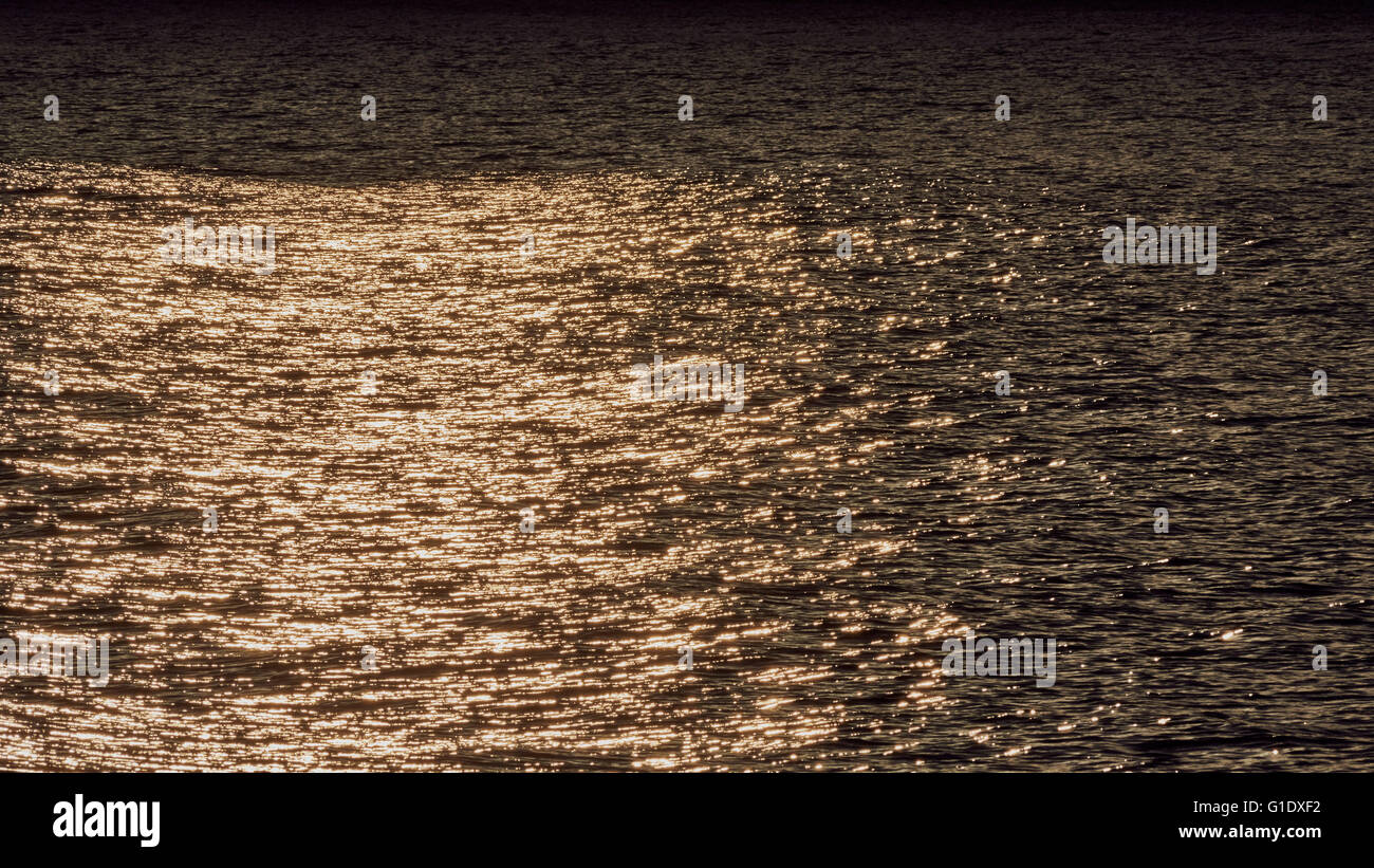 Liquid gold reflection of the early morning sun on the sea Stock Photo ...