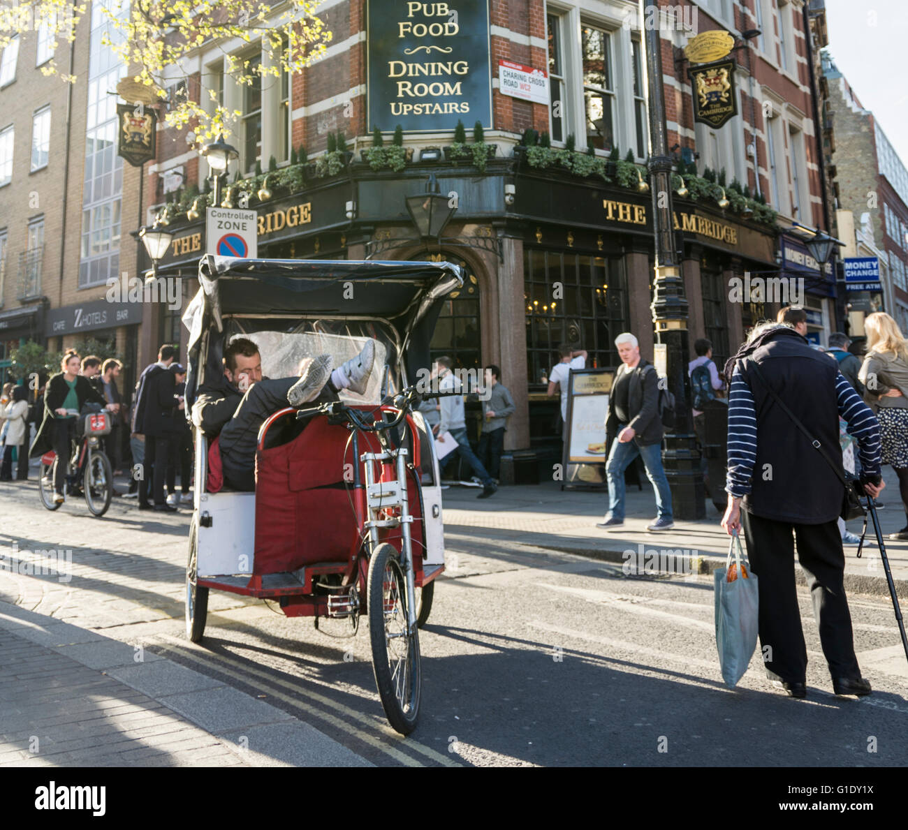Rickshaw drivers take a rest and wait for customers outside The Palace ...