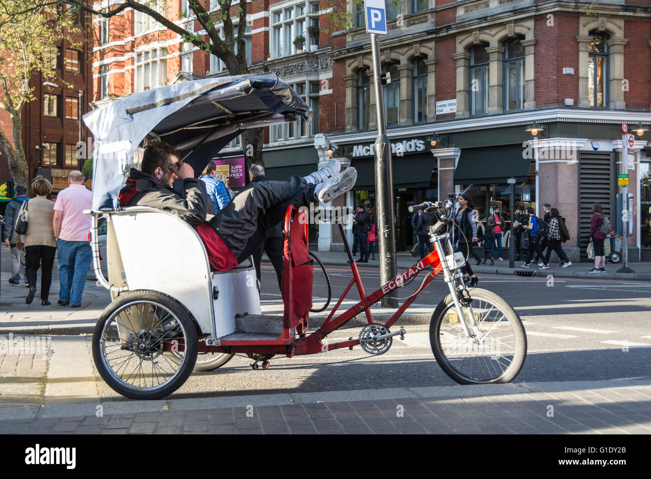 Rickshaw drivers take a rest and wait for customers outside The Palace ...