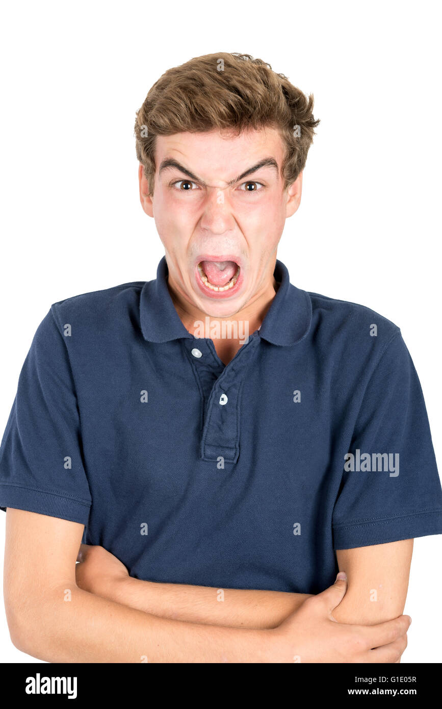 Angry teenage boy making faces isolated in white Stock Photo - Alamy