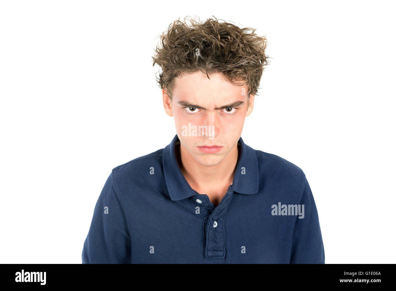 Angry teenage boy making faces isolated in white Stock Photo - Alamy