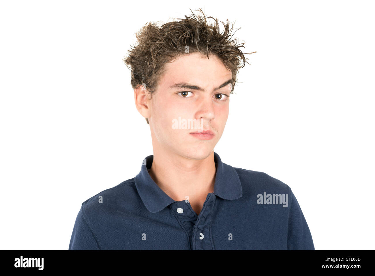 Angry teenage boy making faces isolated in white Stock Photo - Alamy