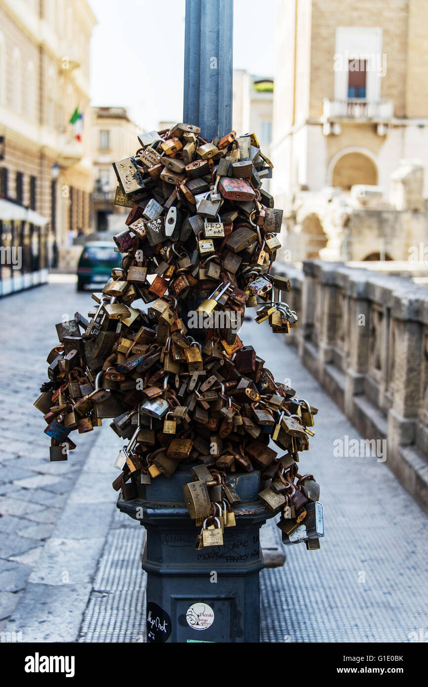 Locks attached to a lamppost in Lecce, Italy Stock Photo - Alamy