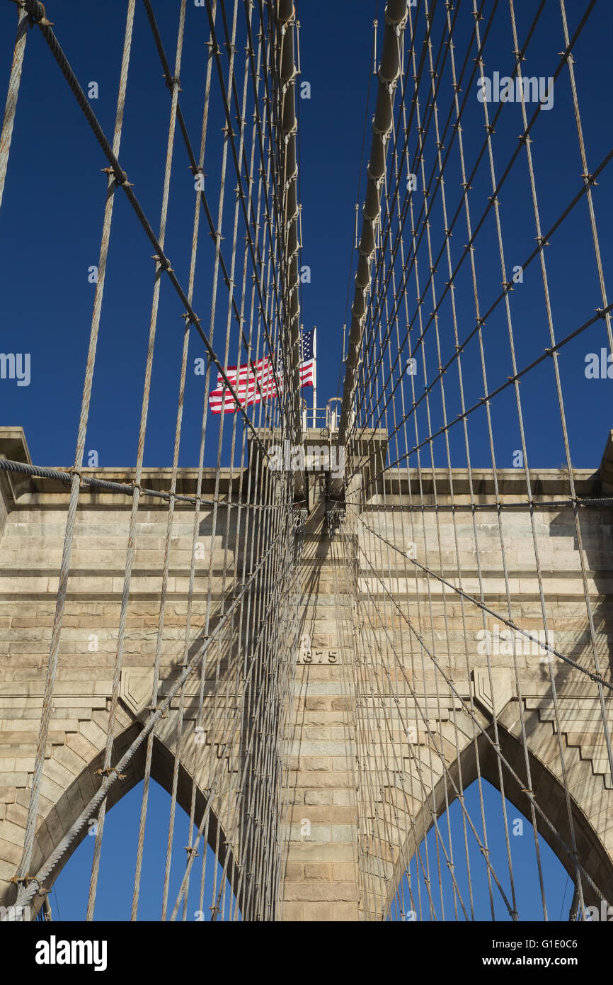 Brooklyn Bridge Pillar with fluttering American flag (New York City ...