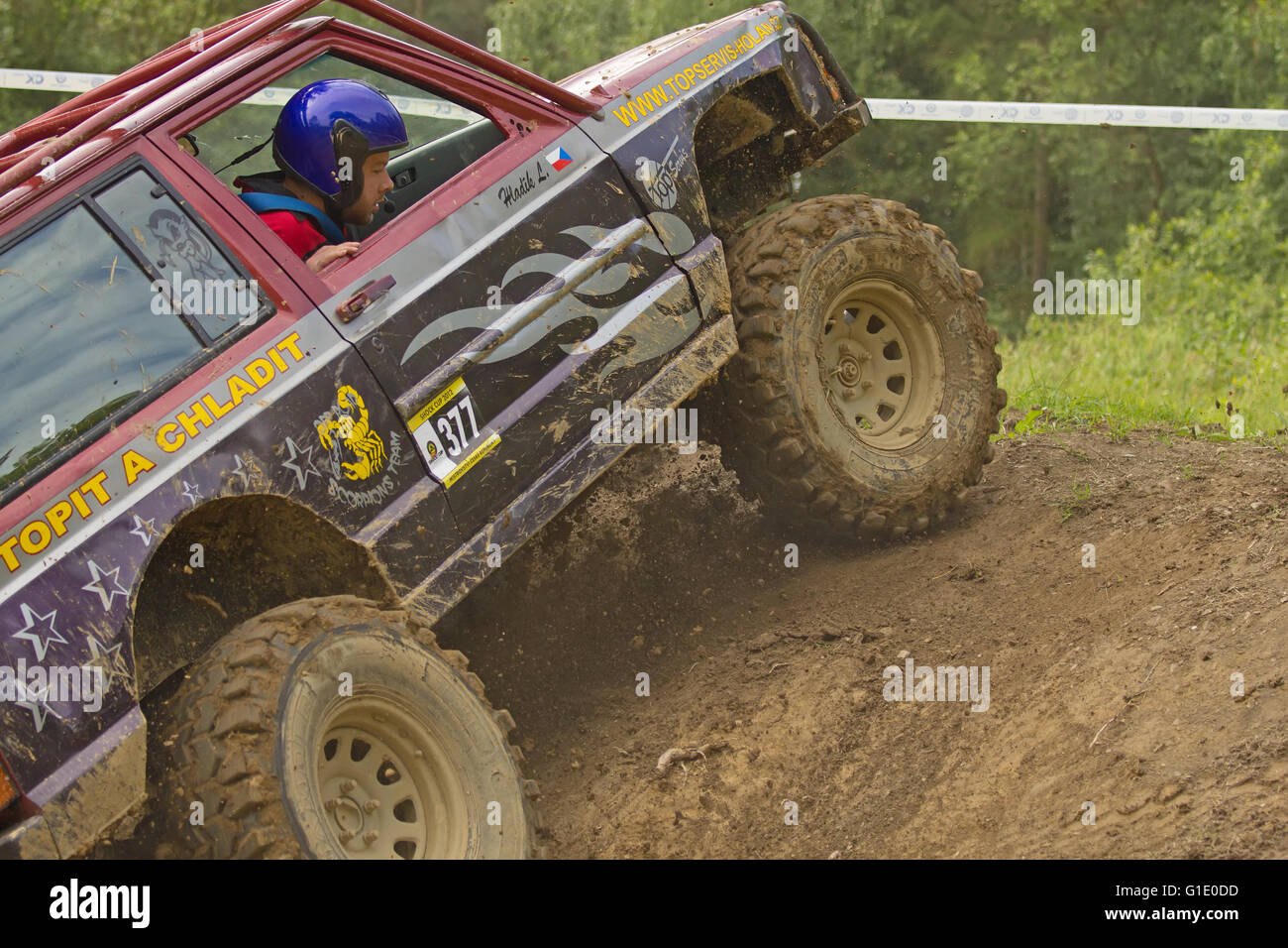 Unidentified racer at off-road car leaves steep slope Stock Photo - Alamy