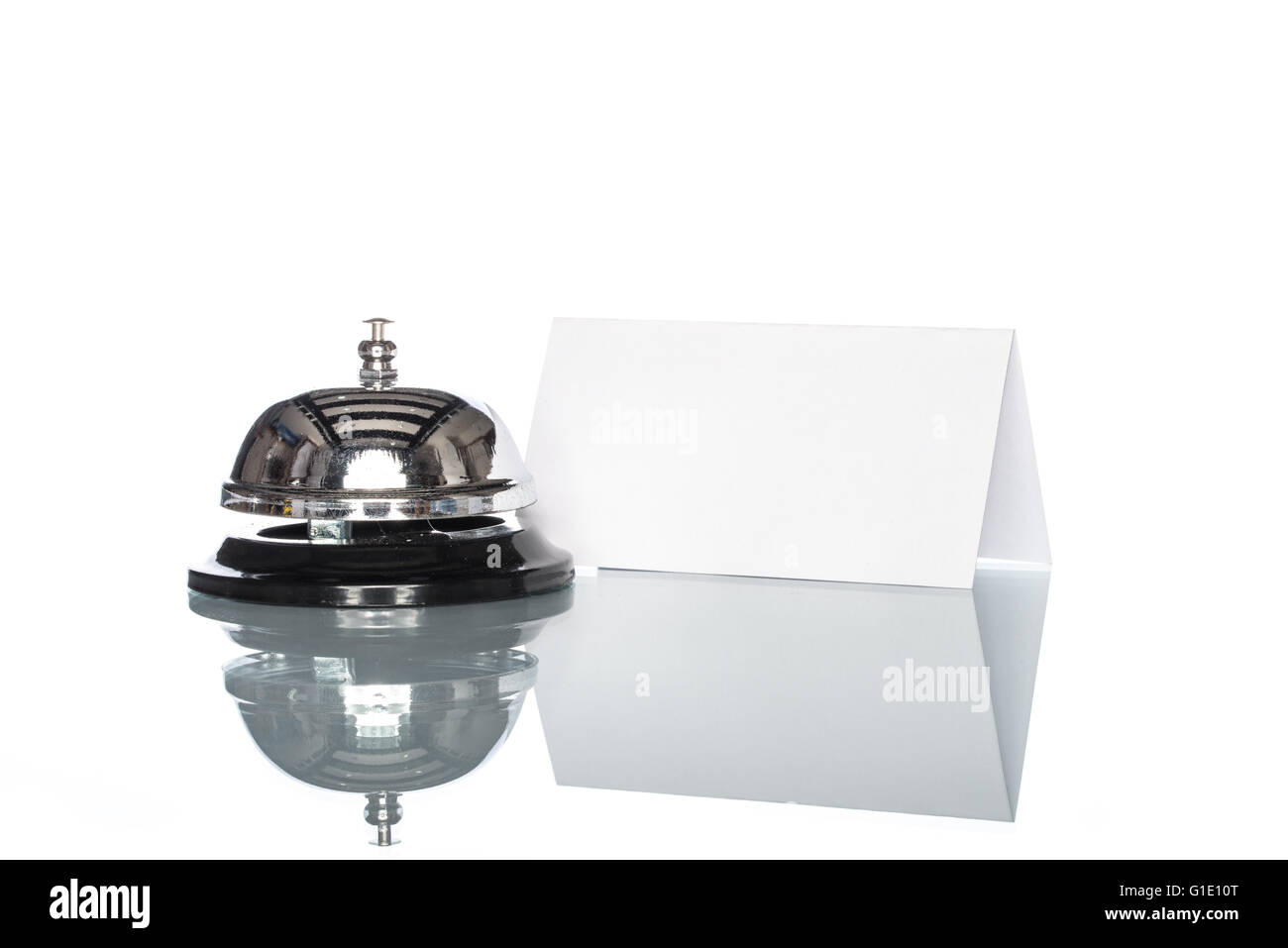 Service bell on the Check in desk with white background Stock Photo - Alamy