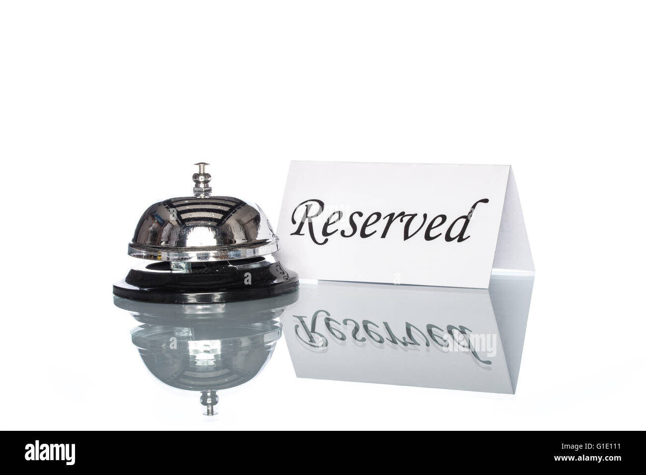 Service bell on the Check in desk with white background Stock Photo - Alamy