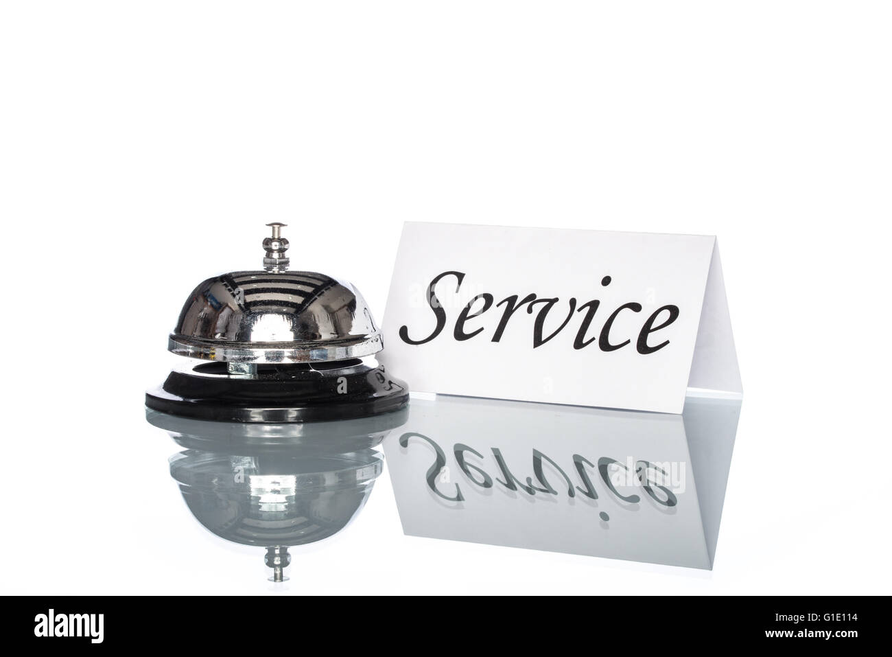 Service bell on the Check in desk with white background Stock Photo - Alamy