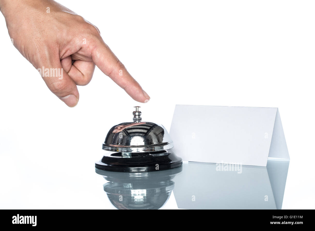 Service bell on the Check in desk with white background Stock Photo - Alamy