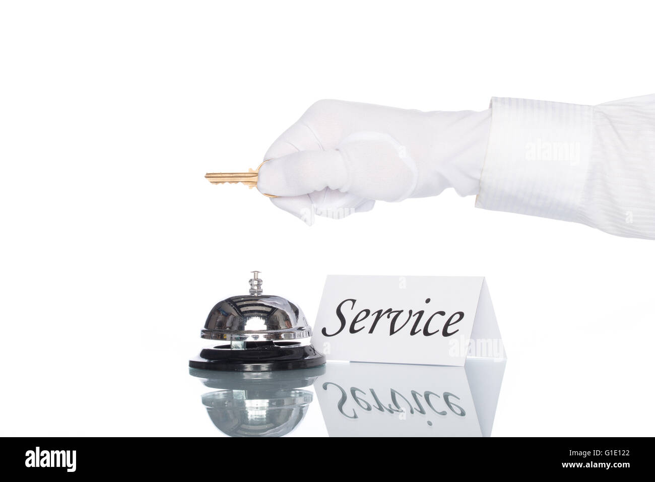 Service bell on the Check in desk with white background Stock Photo - Alamy