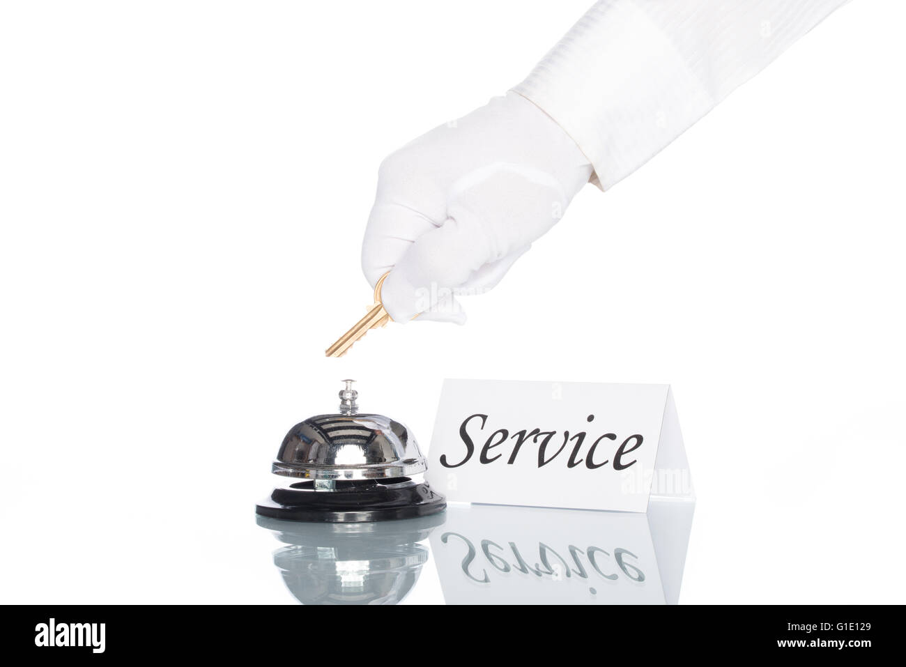 Service bell on the Check in desk with white background Stock Photo - Alamy
