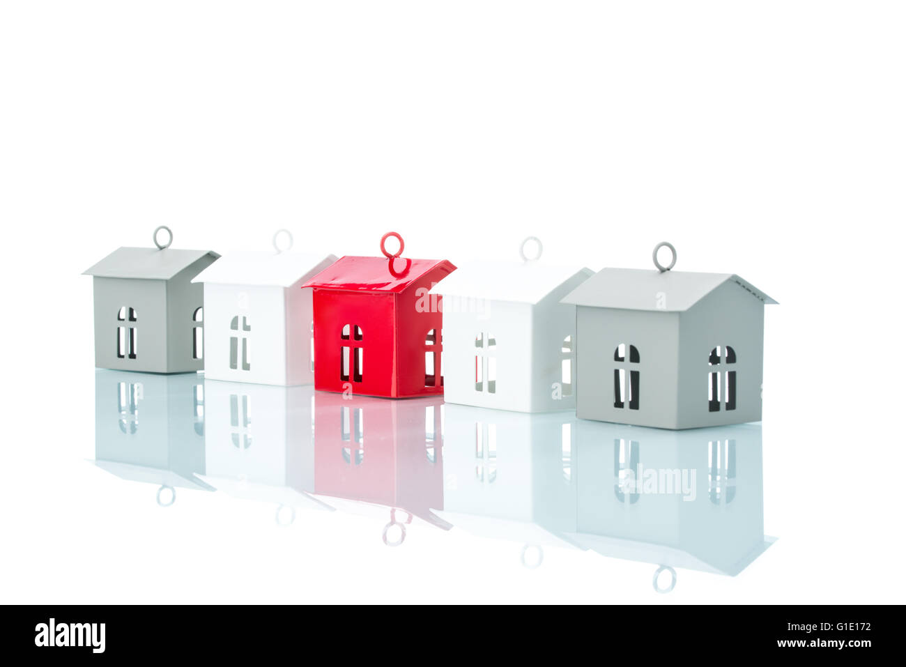 House model in a row, on white background home choice Stock Photo - Alamy