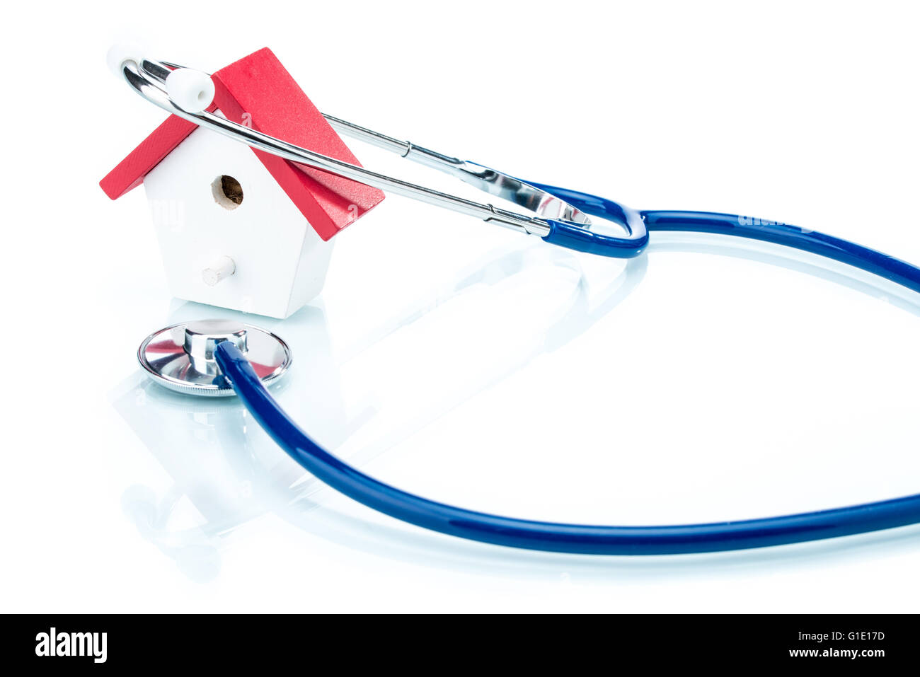 Family health concept, house model with stethoscope, on white ...