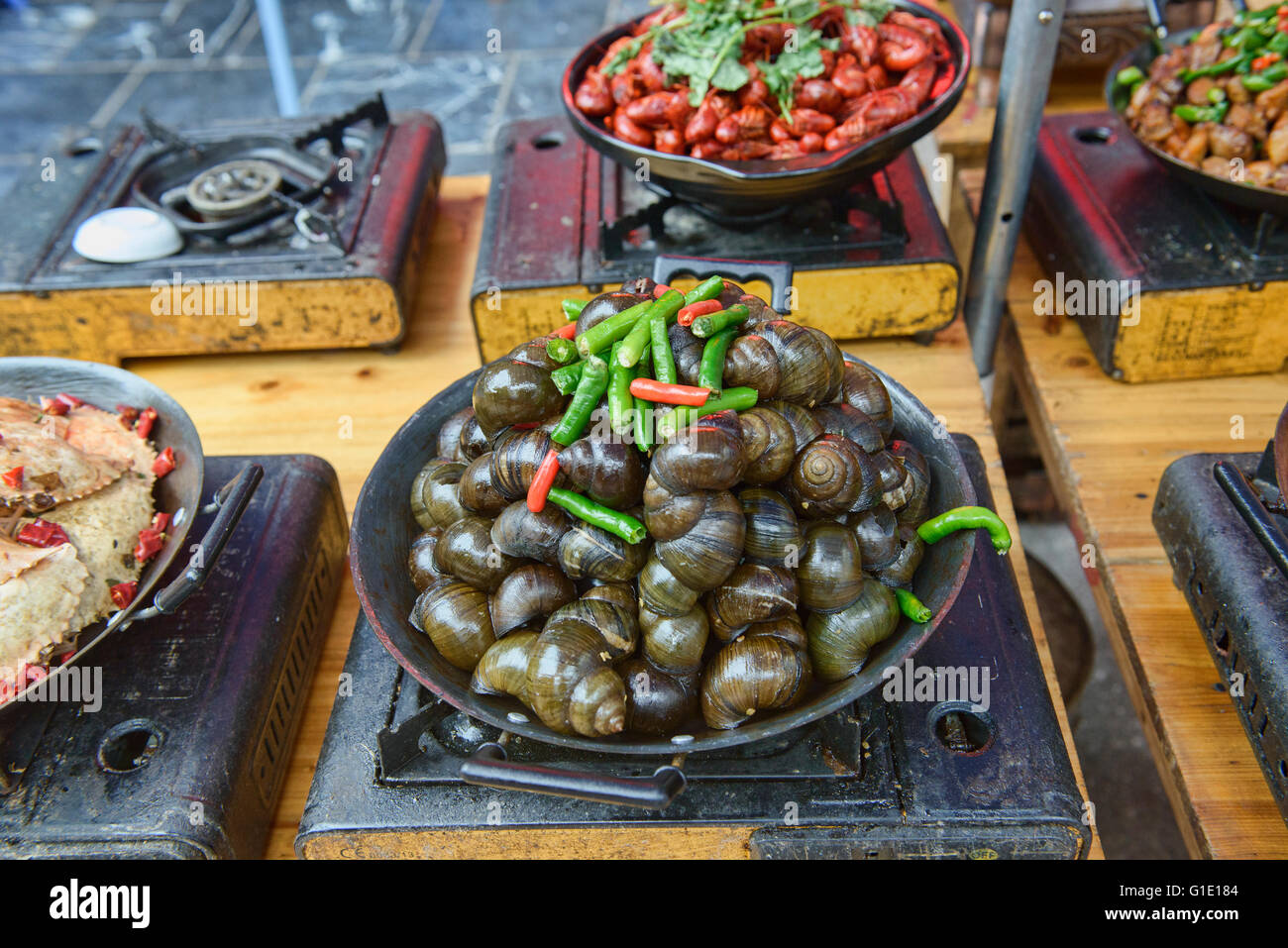 Snails in a restaurant on Gulin's famous Snack Street, Guilin, Guangxi ...