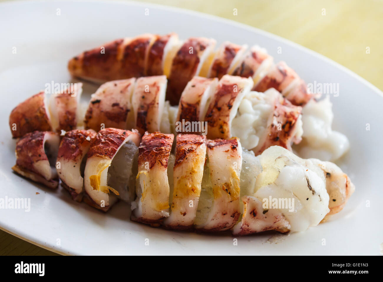 Grilled squid at thai restaurant, thai food Stock Photo - Alamy