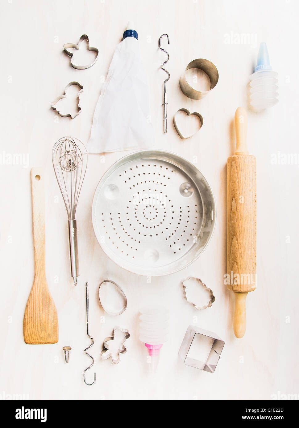 various kitchen tools selection for easter baking on white wooden ...