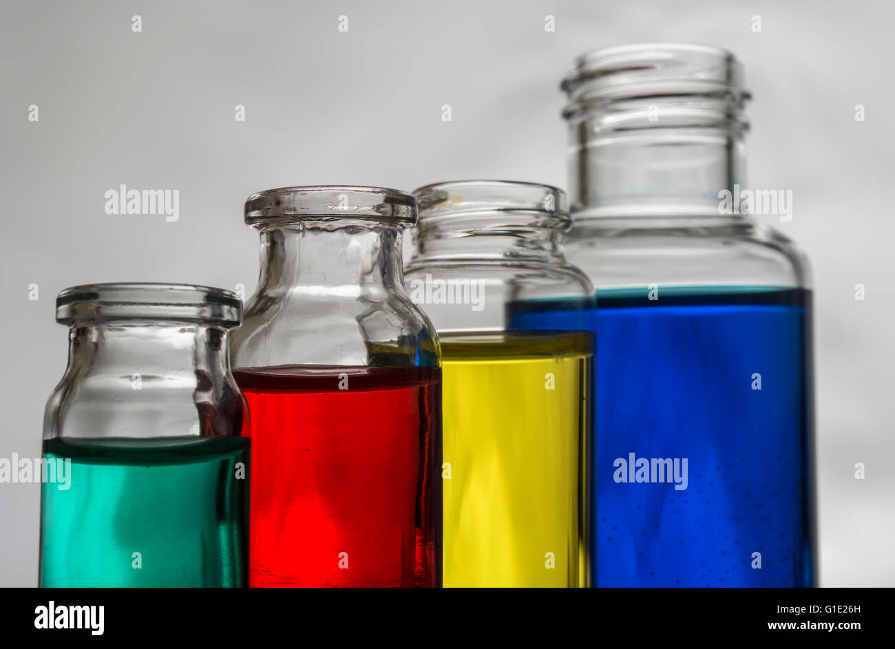 Set of laboratory bottles with color liquid Stock Photo - Alamy