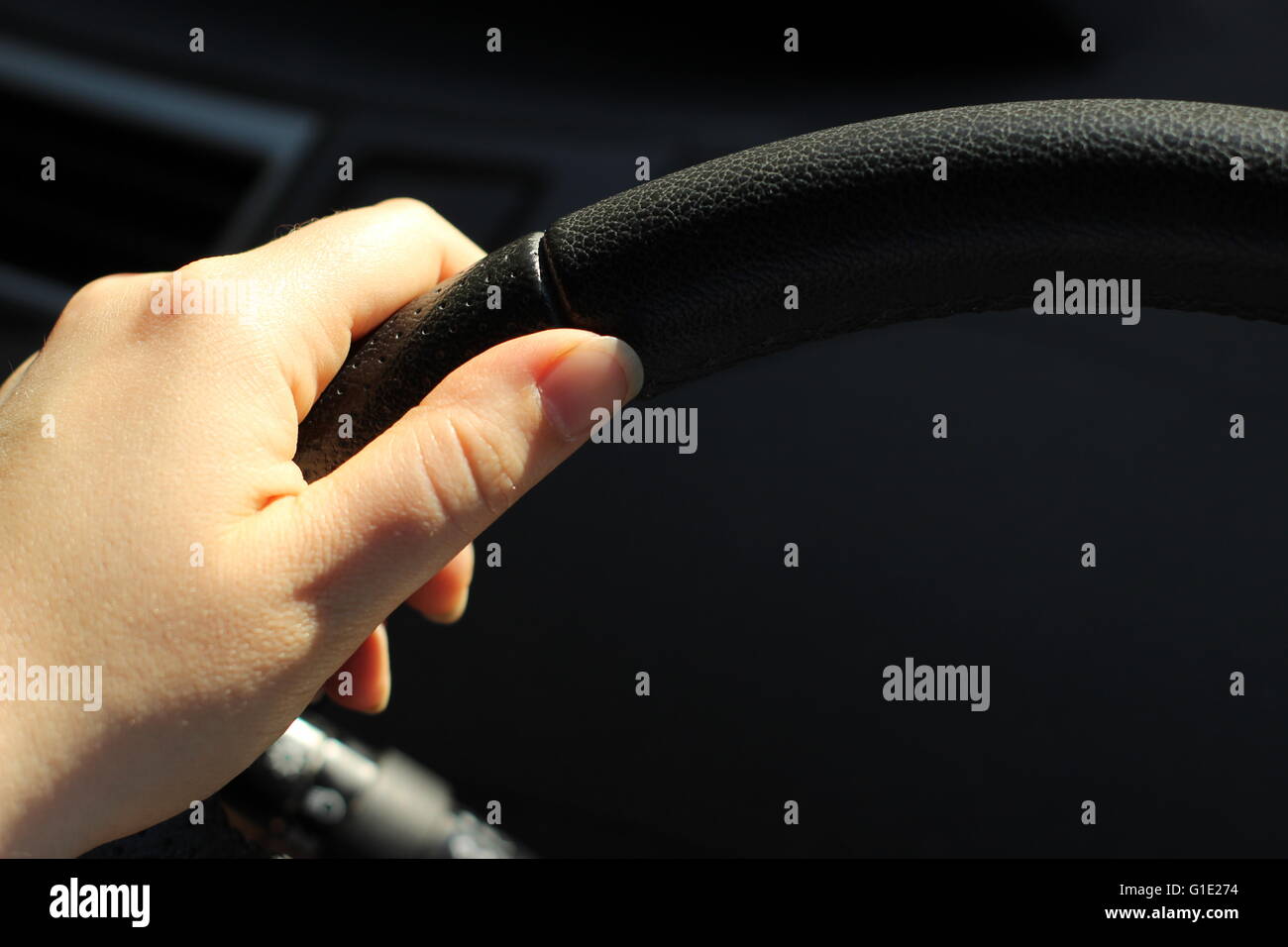 Hand on the car steering wheel Stock Photo - Alamy