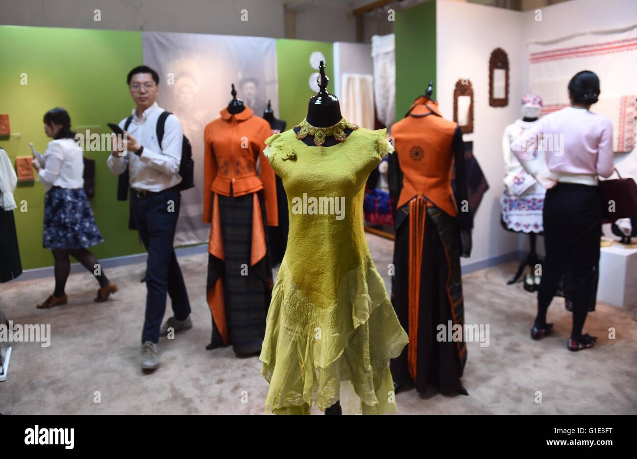 Beijing, China. 13th May, 2016. Visitors view folk costumes of Hungary ...