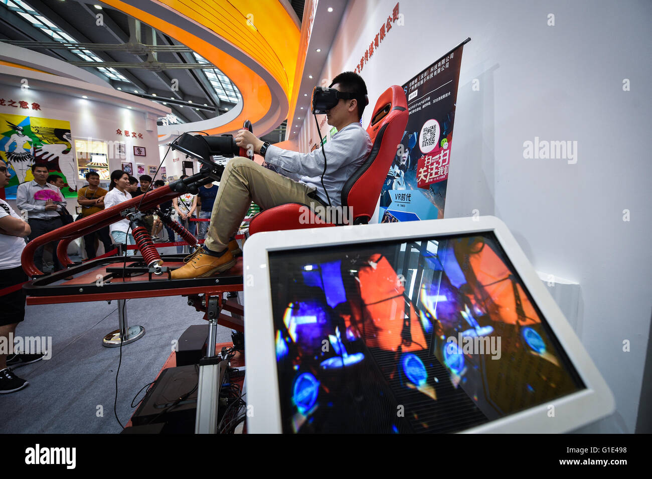 Shenzhen, China's Guangdong Province. 13th May, 2016. A visitor tries ...