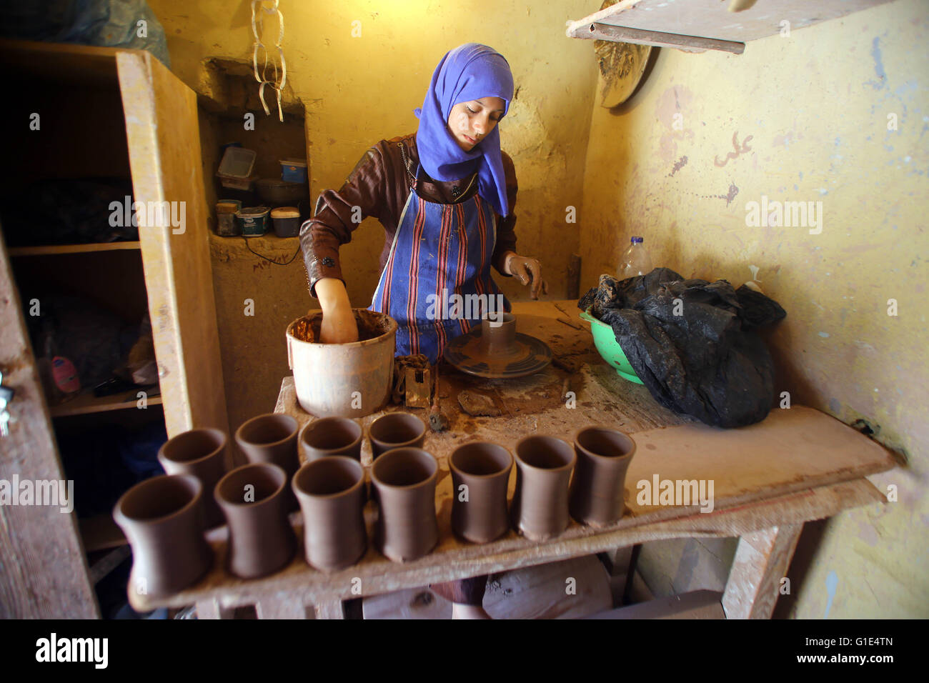Fayoum, Egypt. 10th May, 2016. An Egyptian worker makes pottery at a ...