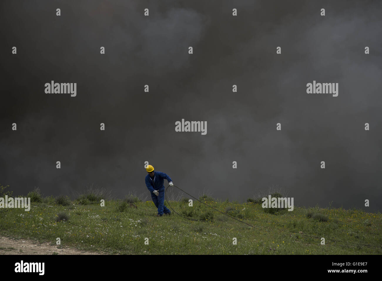 Madrid, Spain. 13th May, 2016. A fire, allegedly caused, fire a ...