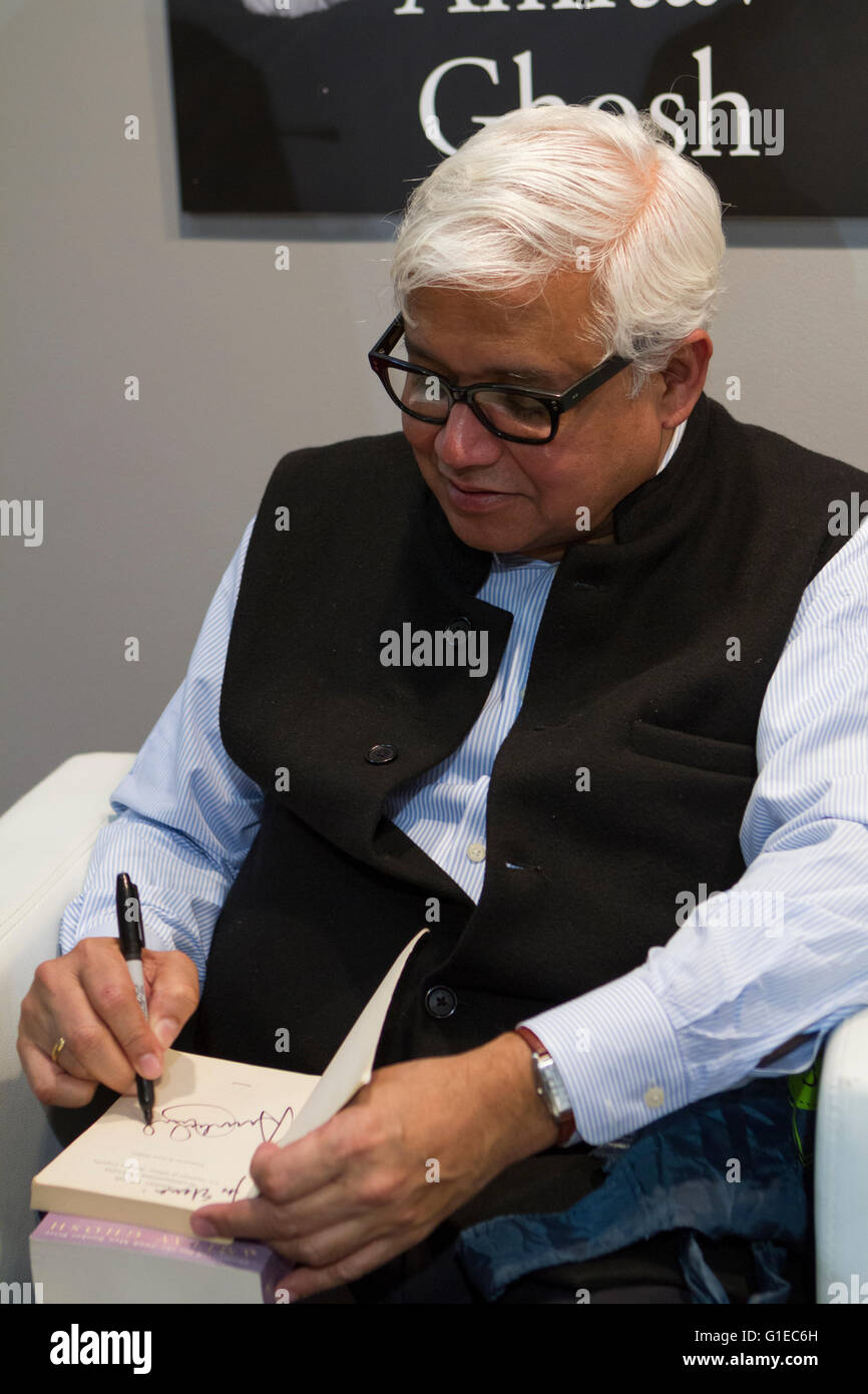 Torino, Italy. 13th May 2016. Indian writer Amitav Ghosh signs an ...