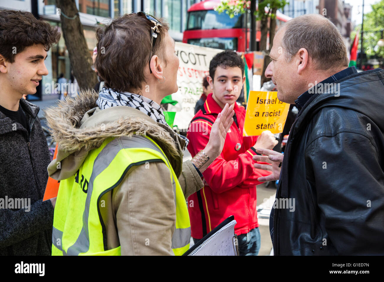London, UK. 14th May, 2016. A steward intervenes to prevent a pro ...