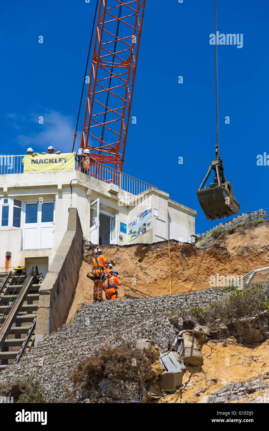 Bournemouth, Dorset, UK 14 May 2016. Abseilers clear fallen debris at ...
