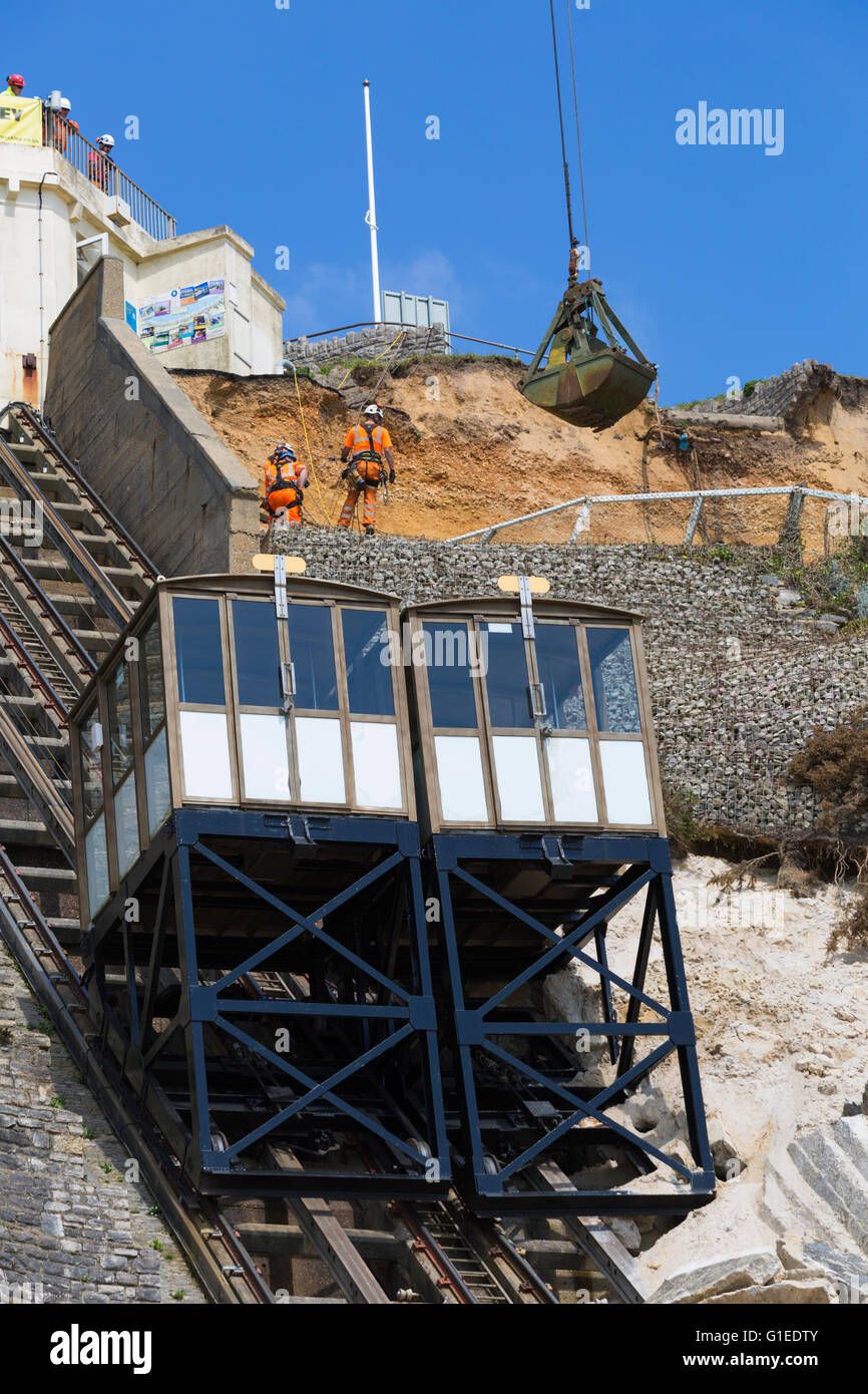 Bournemouth, Dorset, UK 14 May 2016. Abseilers clear fallen debris at ...