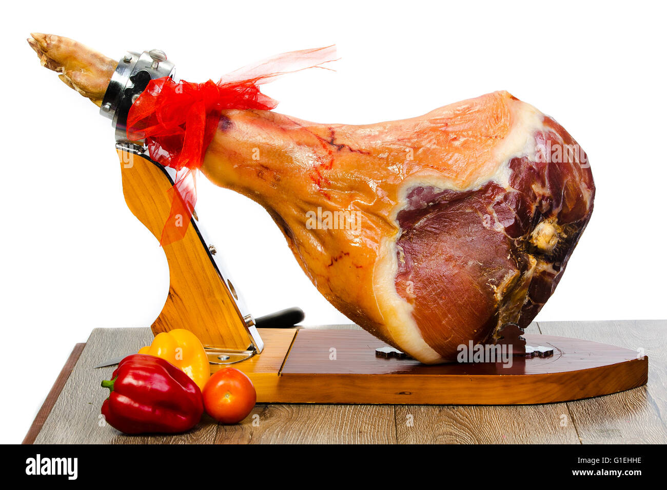 Parma ham (jamon) on a wooden stand isolated on white background Stock ...