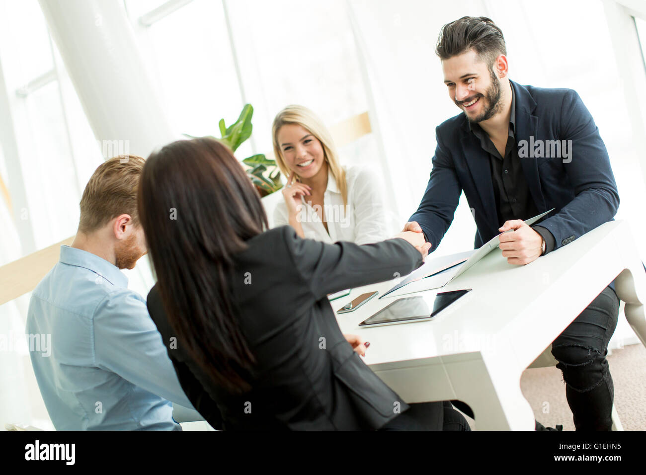 Business people shaking hands in the office Stock Photo - Alamy
