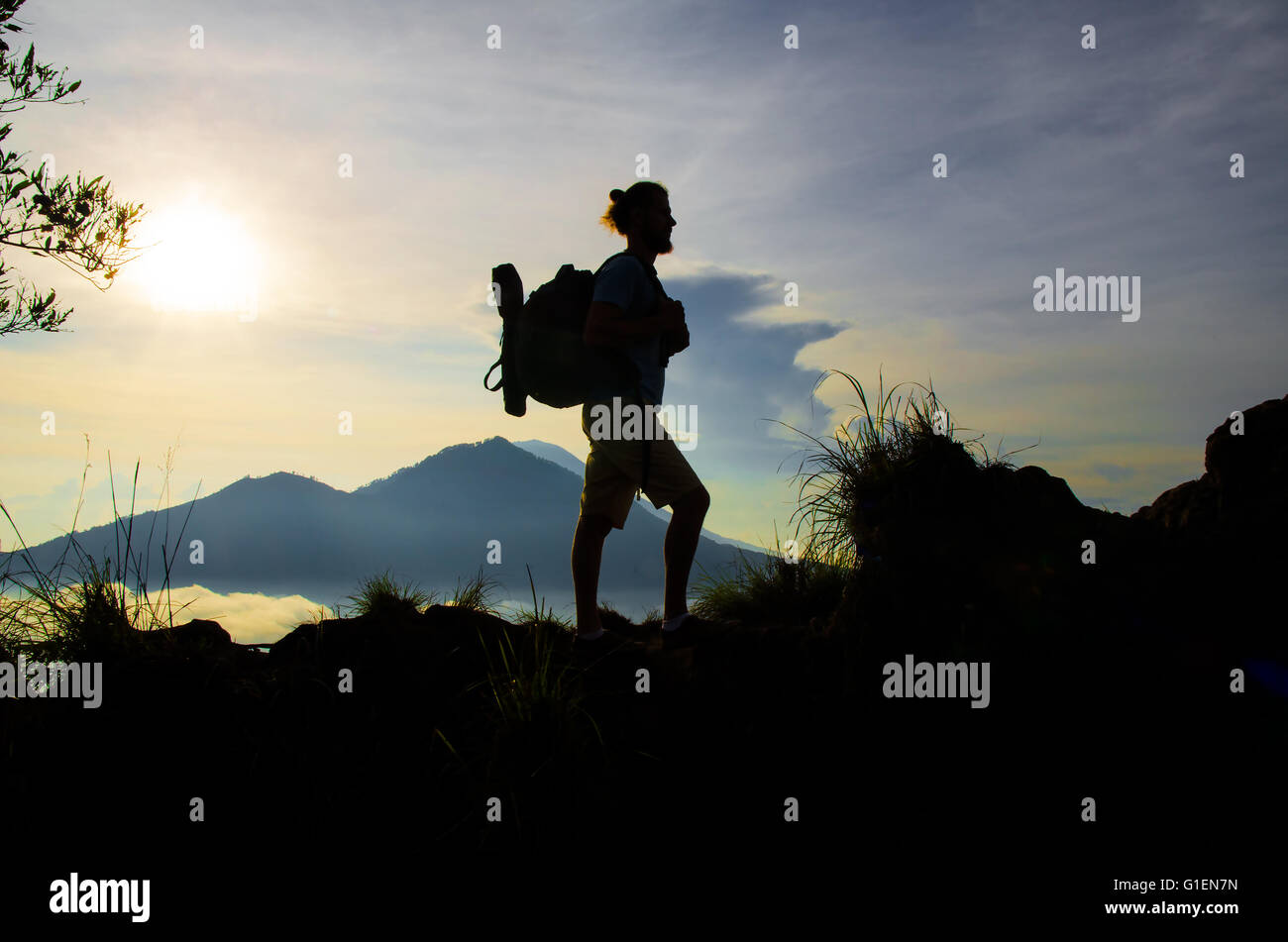 Man climb on mountain hill Stock Photo - Alamy