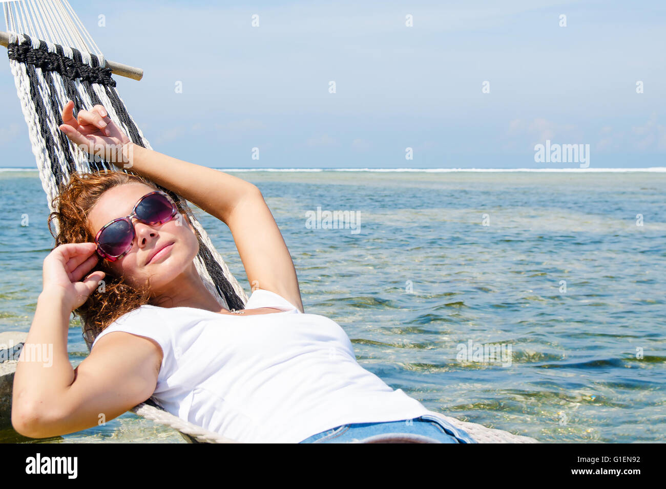 Sunbathing women at beaches hi-res stock photography and images - Alamy