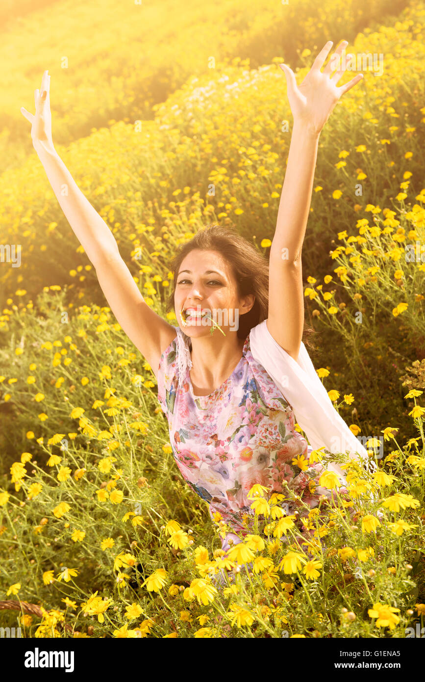 happy exultant and rejoicing girl in a flower field Stock Photo - Alamy
