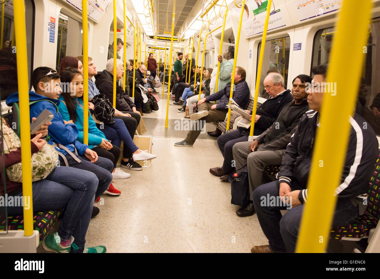 People on The London Underground in London at Liverpool Tube station ...