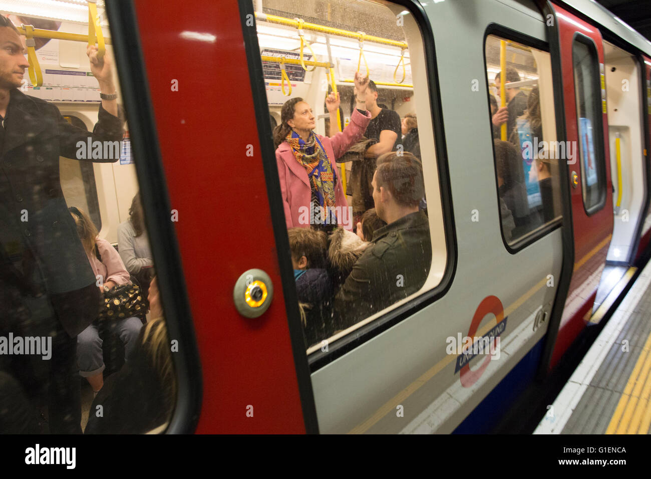People on The London Underground in London at Liverpool Tube station ...