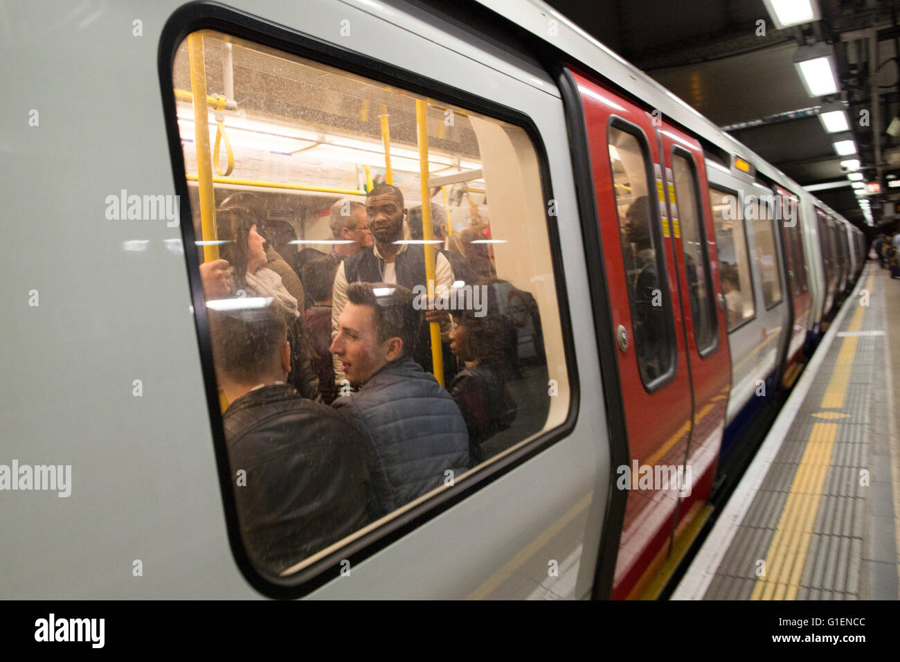 People on The London Underground in London at Liverpool Tube station ...