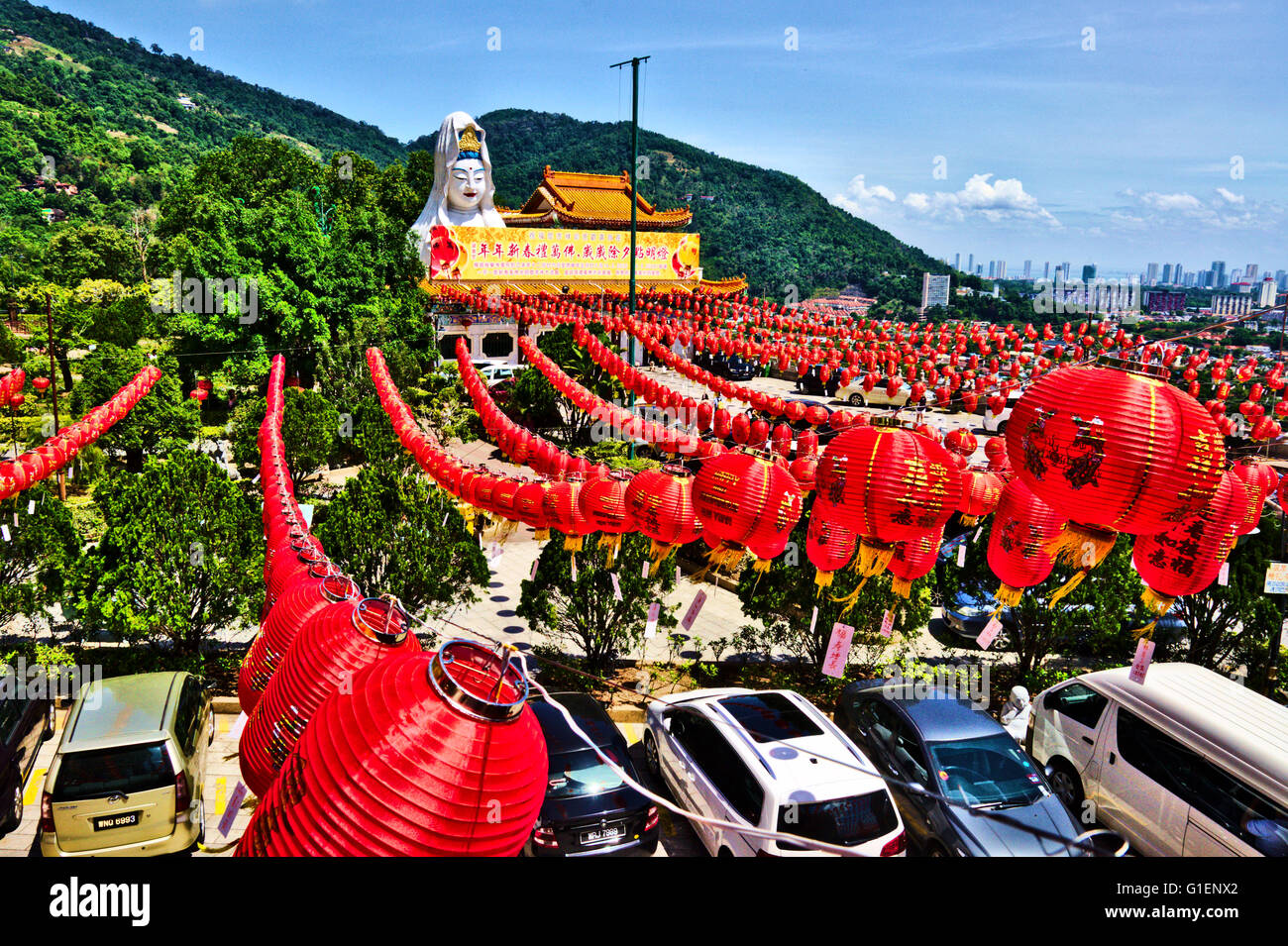 Strings of hundreds of red lanterns lead one's eyes to the huge bust of ...