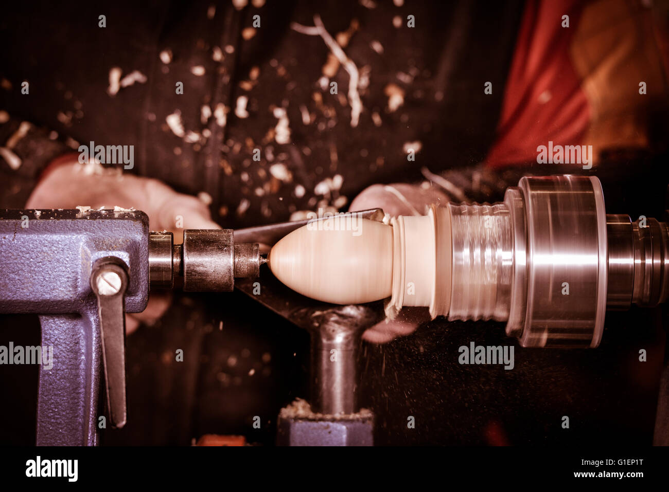 Wood turners using a rotating clamp to turn the wood, France Stock ...