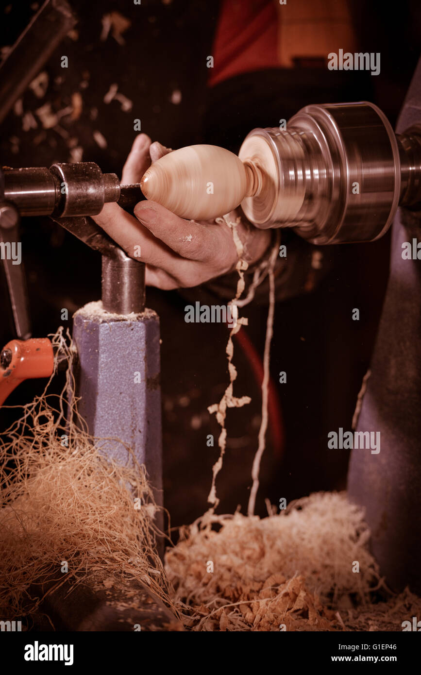 Wood turners using a rotating clamp to turn the wood, France Stock ...
