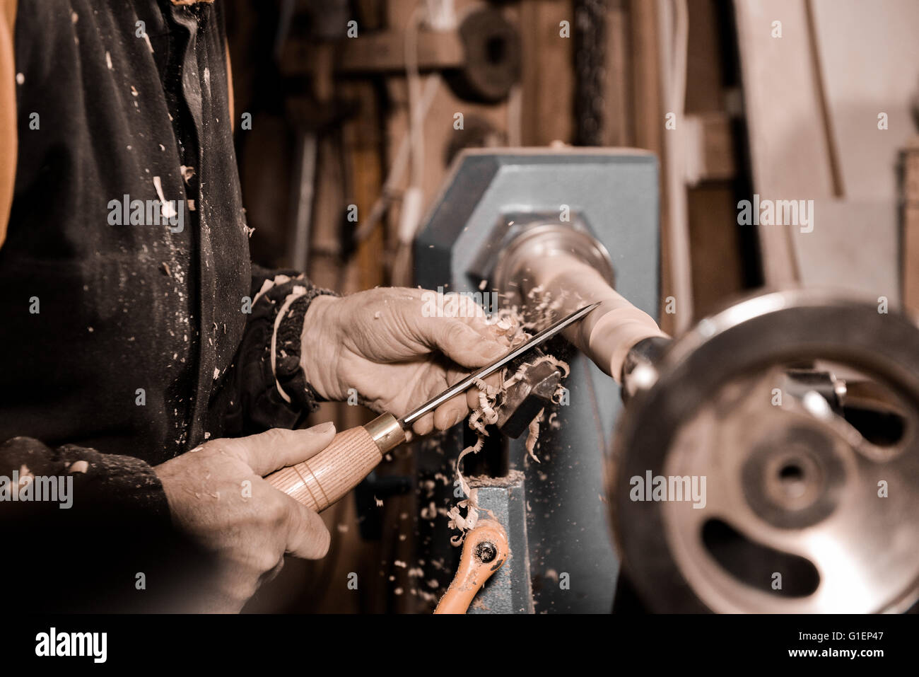 Wood turners using a rotating clamp to turn the wood, France Stock ...