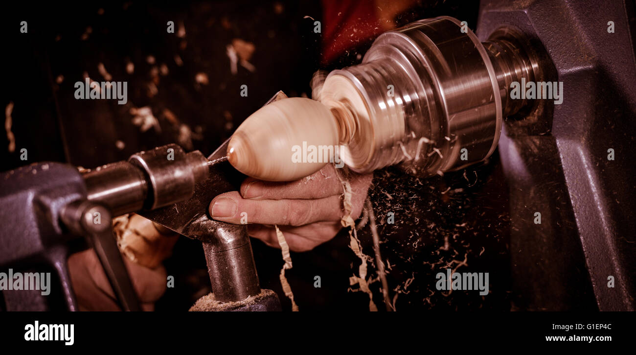 Wood turners using a rotating clamp to turn the wood, France Stock ...