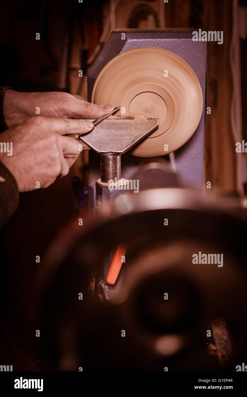 Wood turners using a rotating clamp to turn the wood, France Stock ...