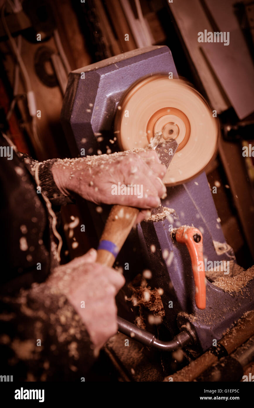 Wood turners using a rotating clamp to turn the wood, France Stock ...