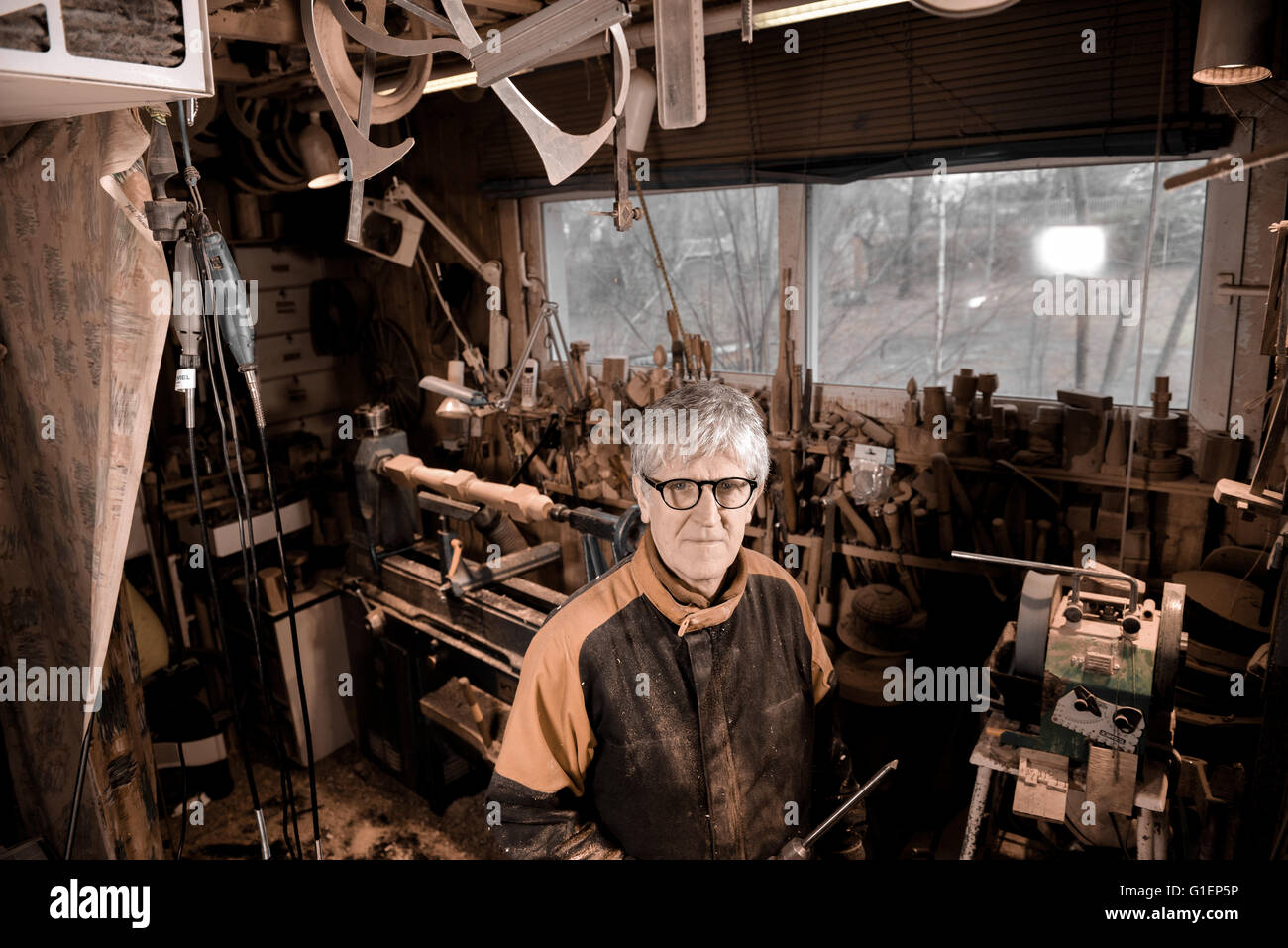 Wood turners using a rotating clamp to turn the wood, France Stock ...