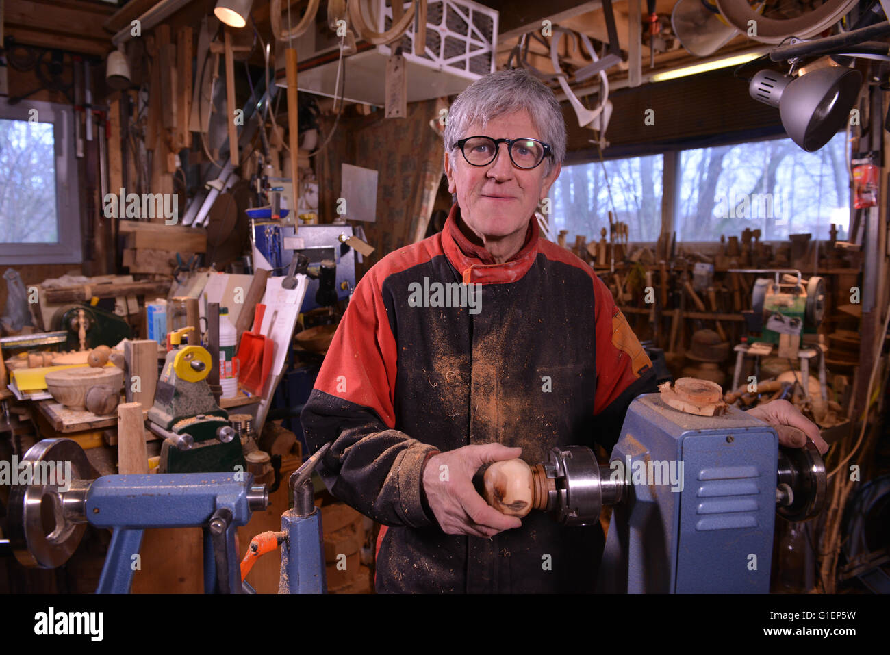 Wood turners using a rotating clamp to turn the wood, France Stock ...