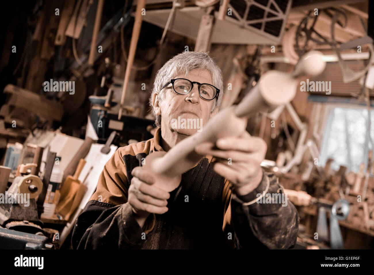 Wood turners using a rotating clamp to turn the wood, France Stock ...