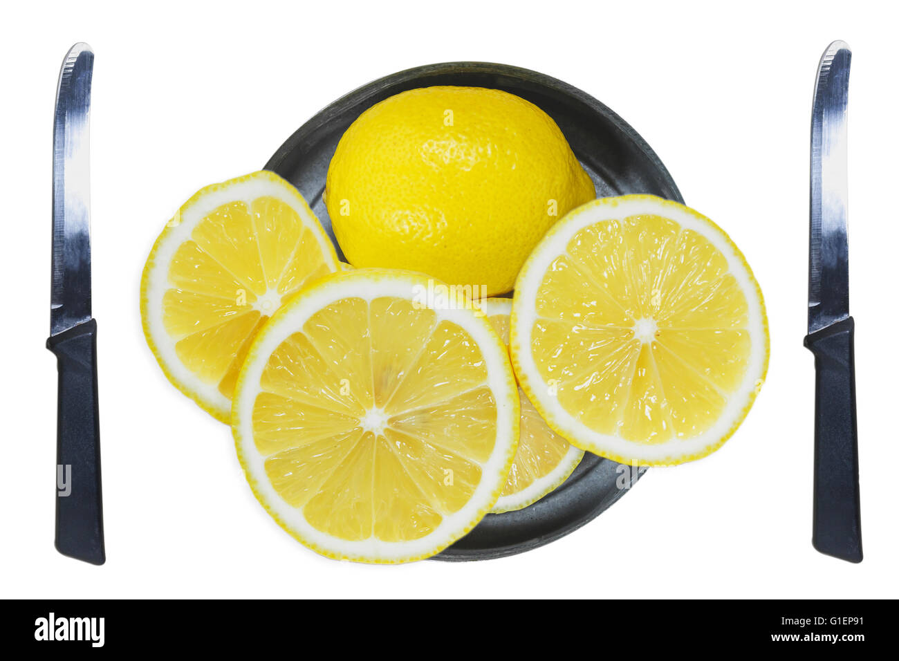 Sliced lemons with knife isolated on white background Stock Photo - Alamy