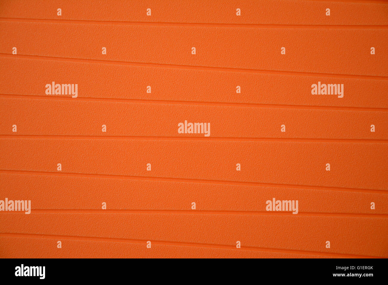 Orange rubber tablemat with grooves closeup - background Stock Photo ...